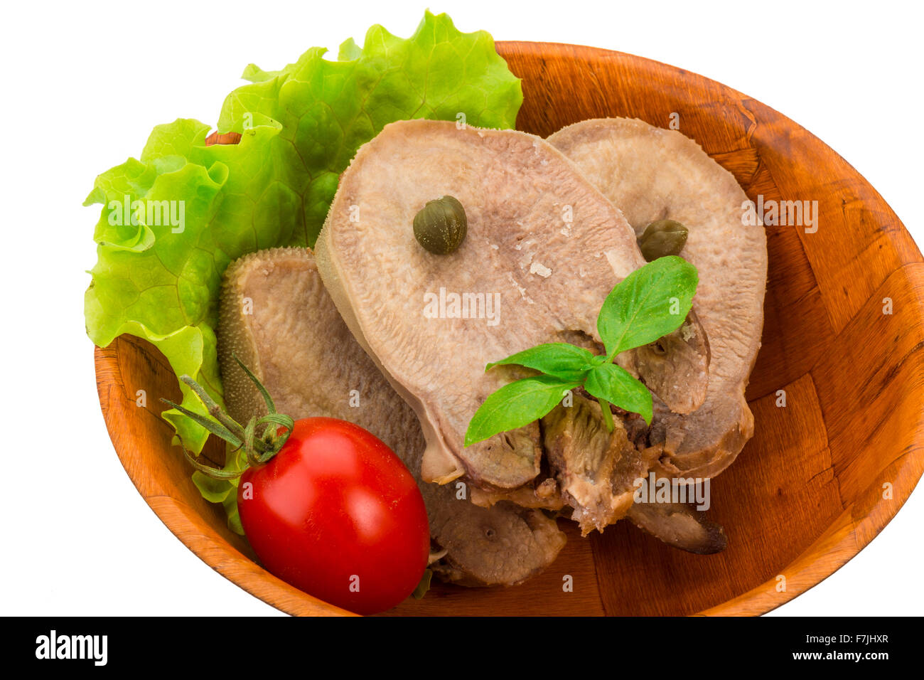 Beef tongue with herbs isolated Stock Photo - Alamy