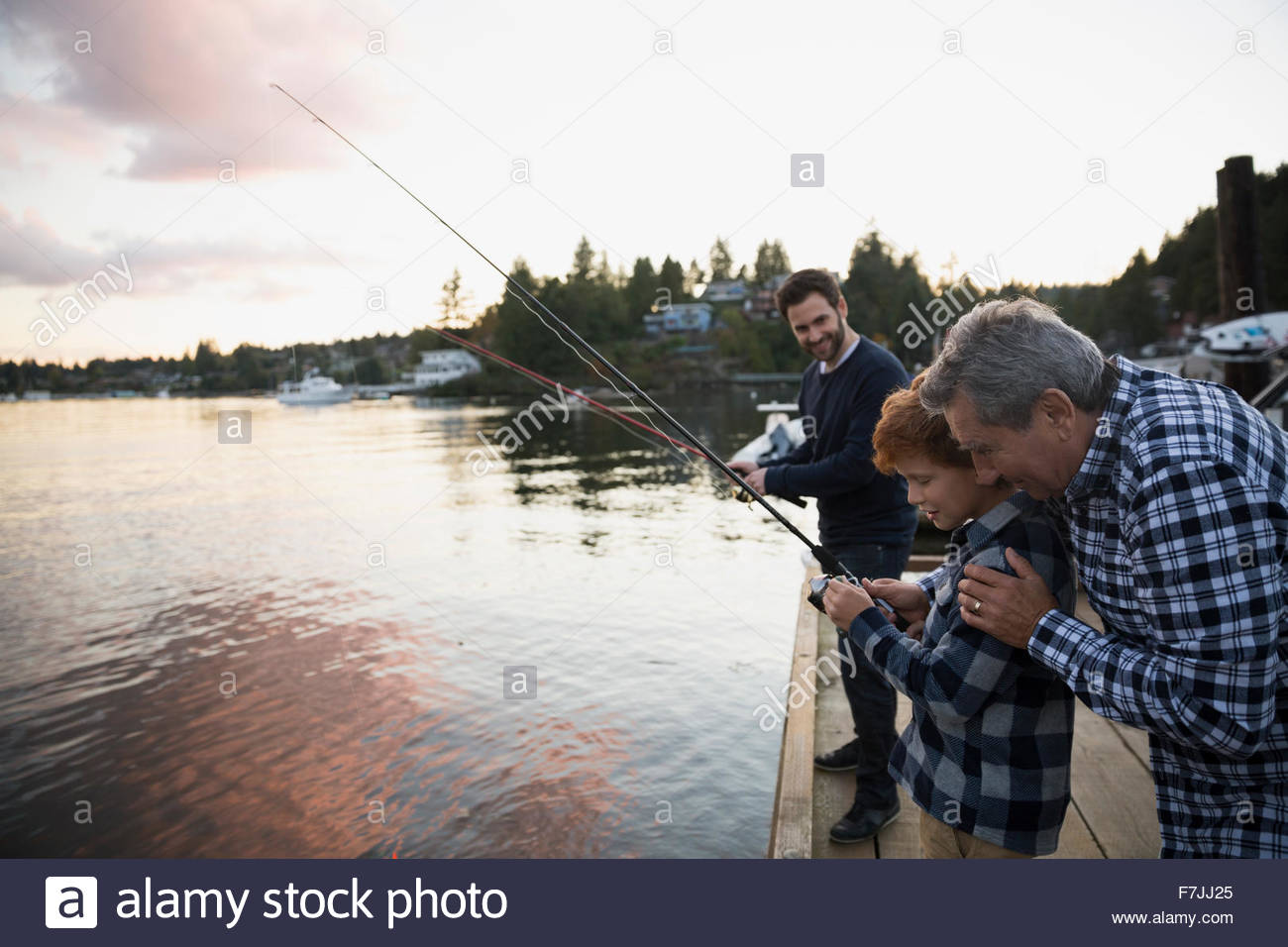 Boy fishing sunset hi-res stock photography and images - Alamy