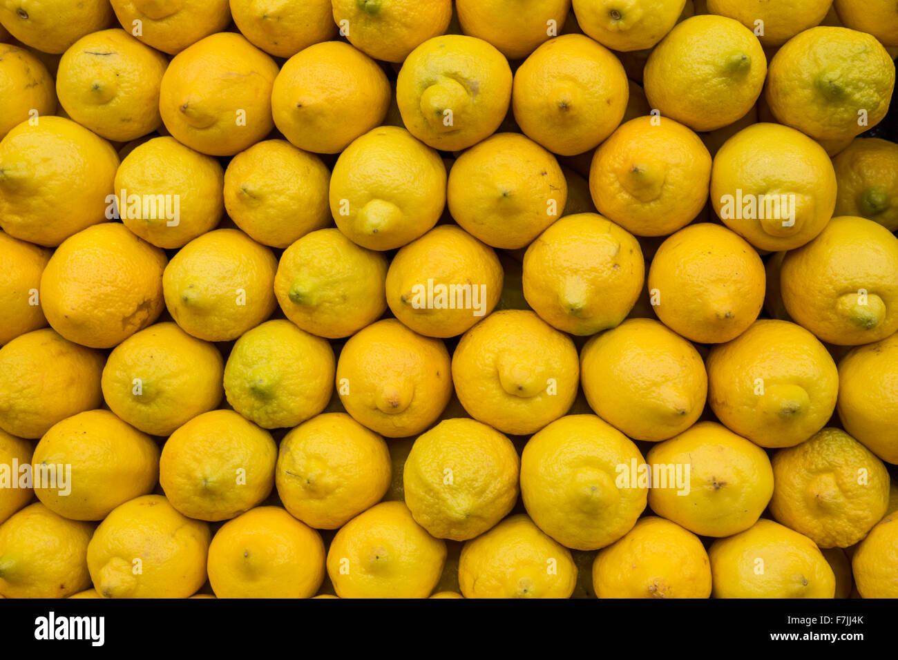 stack of fresh lemons at produce market display Stock Photo - Alamy