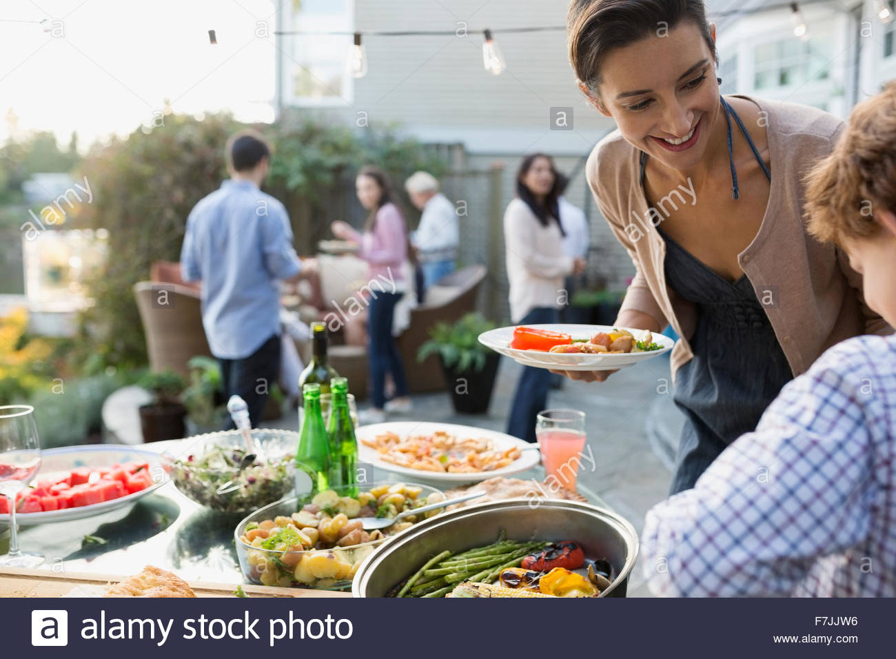 Child serving food hi-res stock photography and images - Alamy