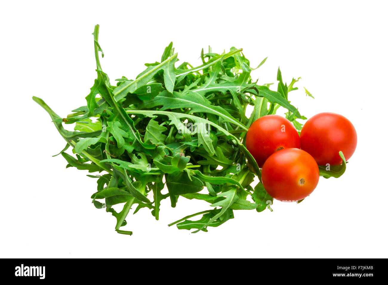 Ruccola with tomato cherry isolated Stock Photo - Alamy