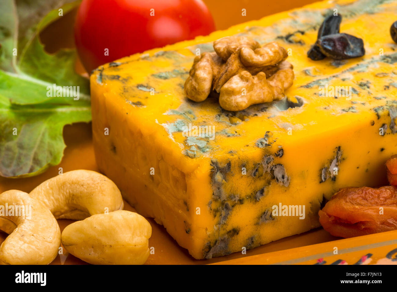 Gold cheese with mould Stock Photo - Alamy