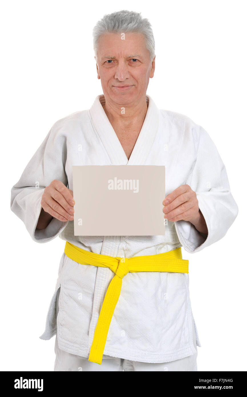 Karate Senior man with poster Stock Photo - Alamy