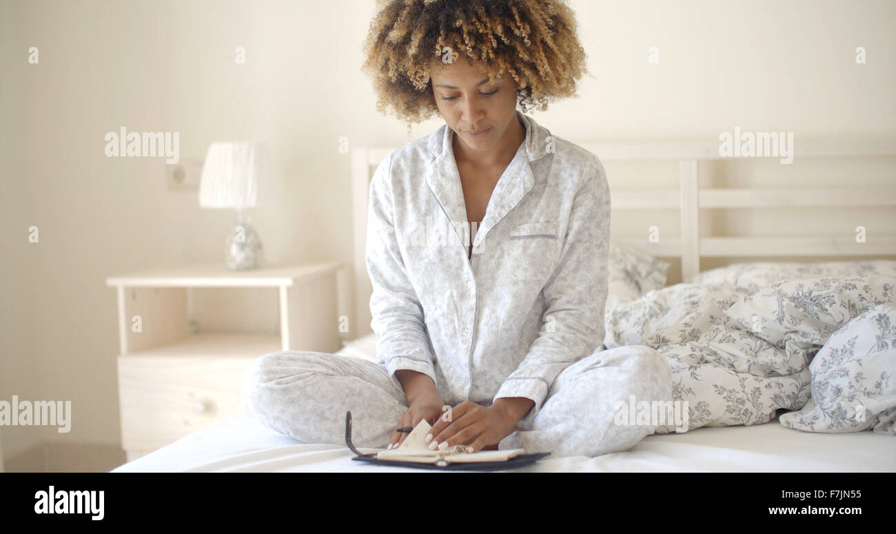 Girl Writes A Diary In Bed Stock Photo - Alamy