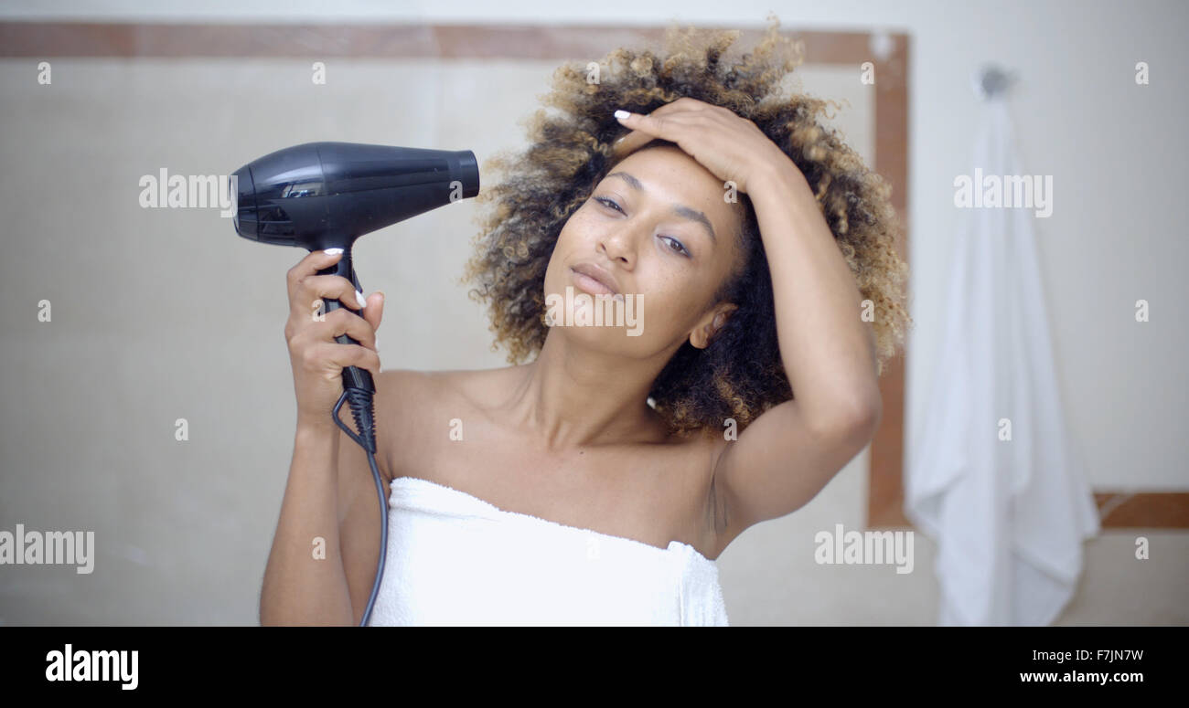 Woman drying her hair hi-res stock photography and images - Alamy