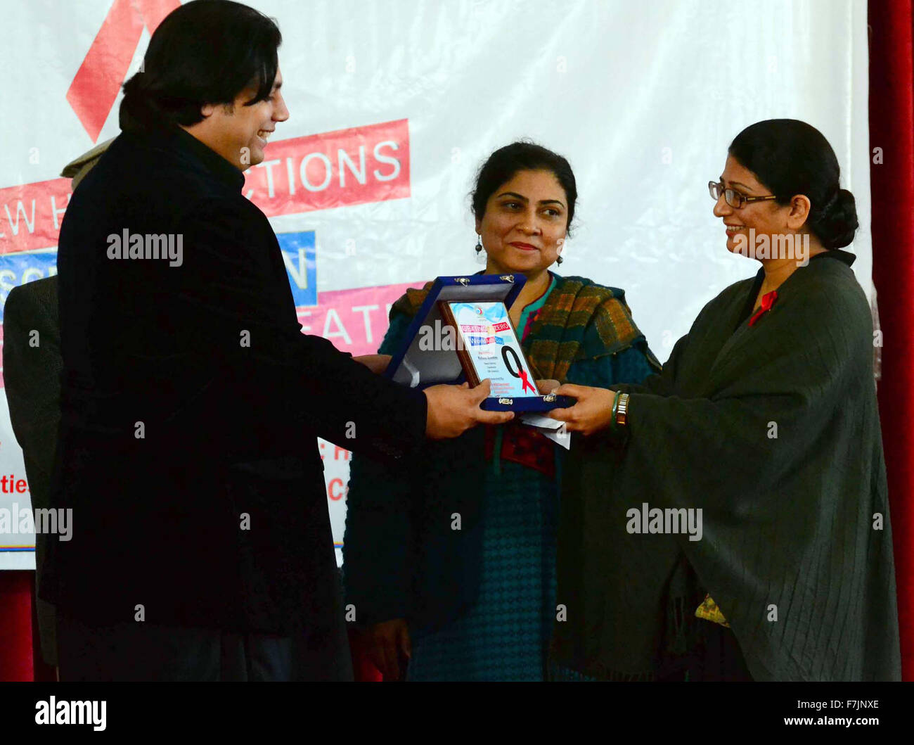 Honorary shields are being handing over to participants of seminar on ...