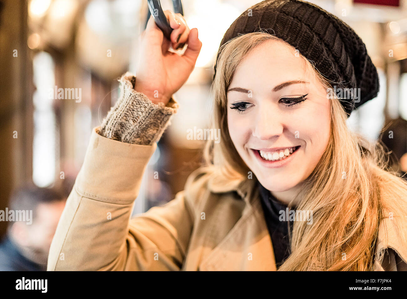 Beautiful woman inside the tram Stock Photo - Alamy