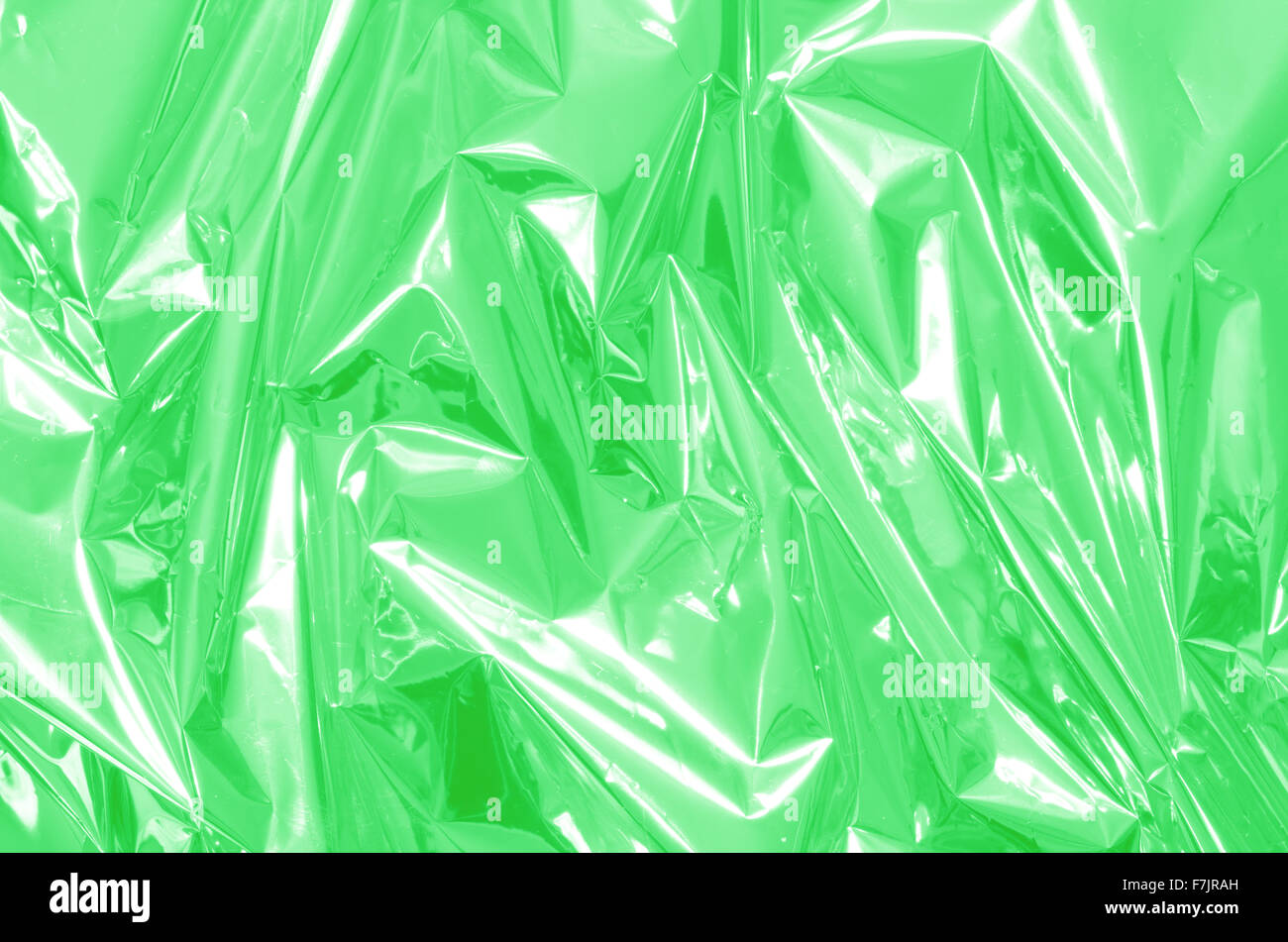 green shiny metallic foil background Stock Photo - Alamy
