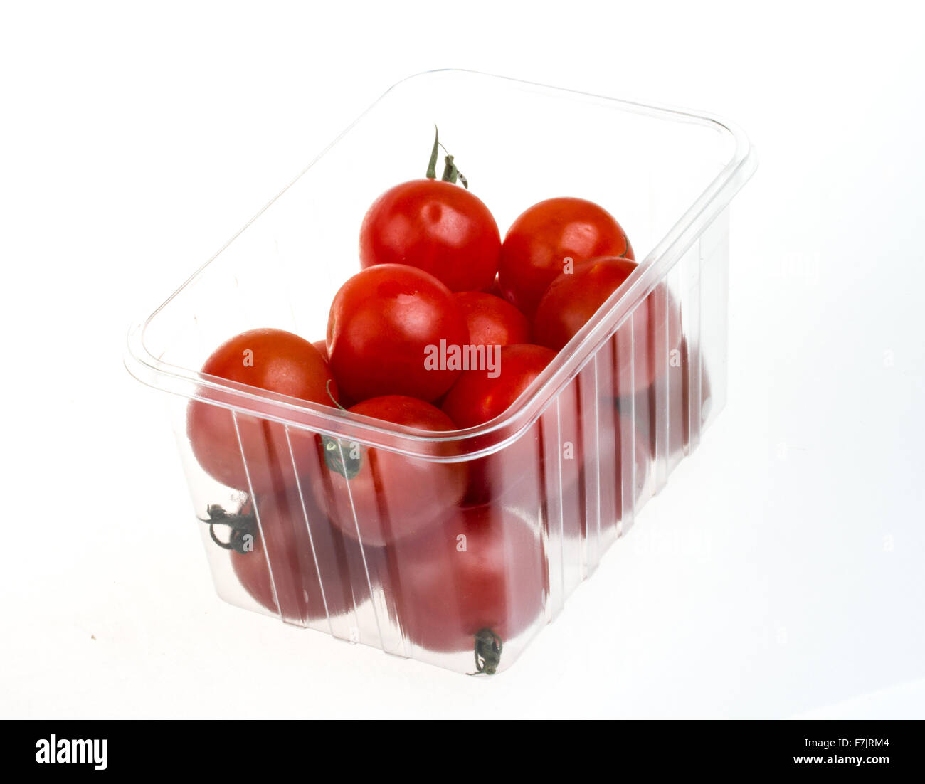 Small cherry tomato on white background close up Stock Photo - Alamy
