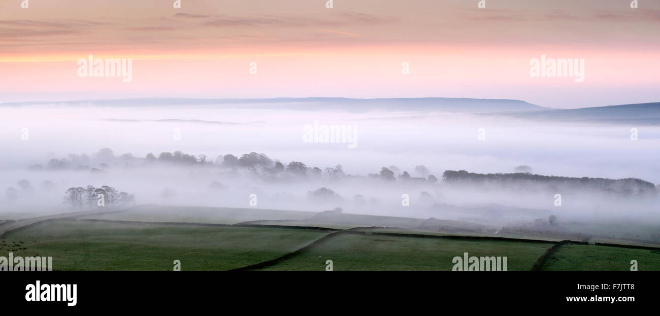 Mist rising over East Halton and Embsay in Lower Wharfedale Stock Photo ...