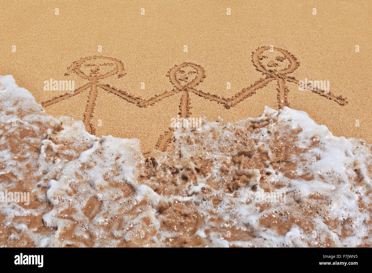 Happy family drawing on beach hi-res stock photography and images - Alamy