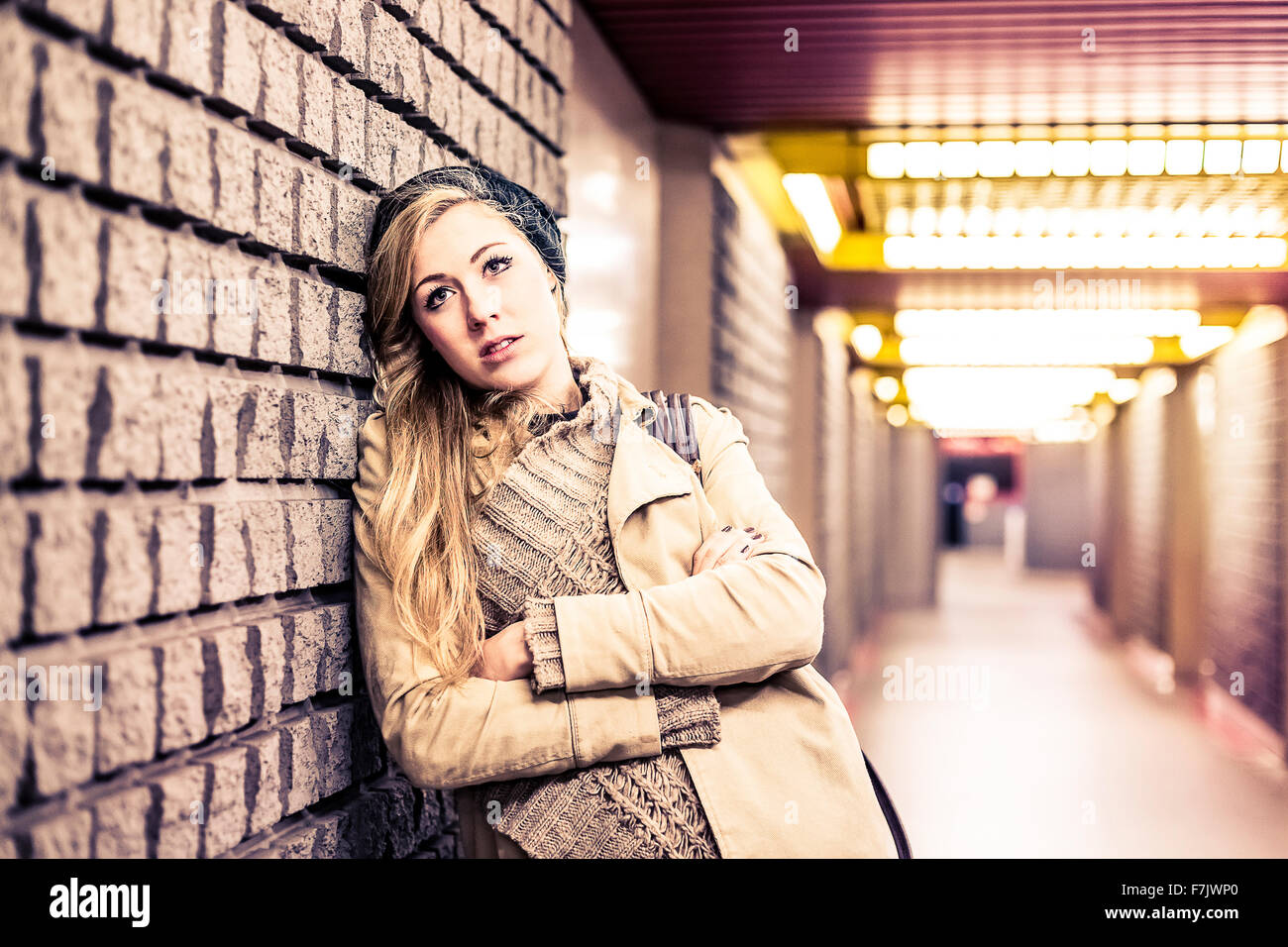 Sad woman at the subway station Stock Photo - Alamy