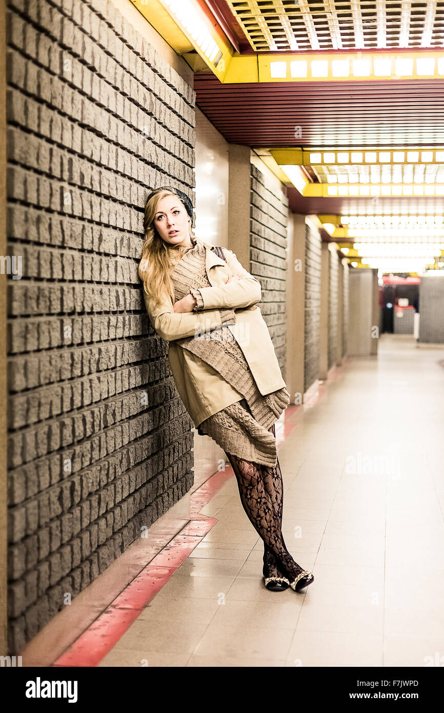 Sad woman at the subway station Stock Photo - Alamy