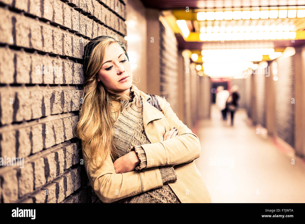 Sad woman at the subway station Stock Photo - Alamy