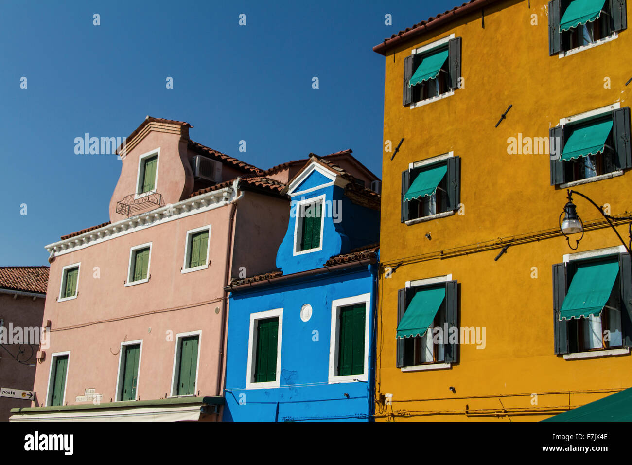 The row of colorful houses in Burano street, Italy Stock Photo - Alamy