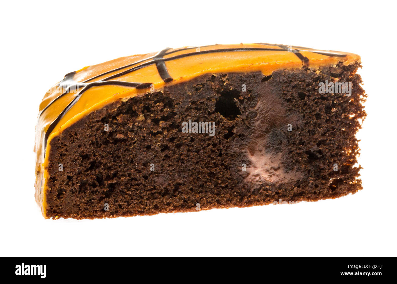 Piece of chocolate cake with icing on white isolated background Stock ...