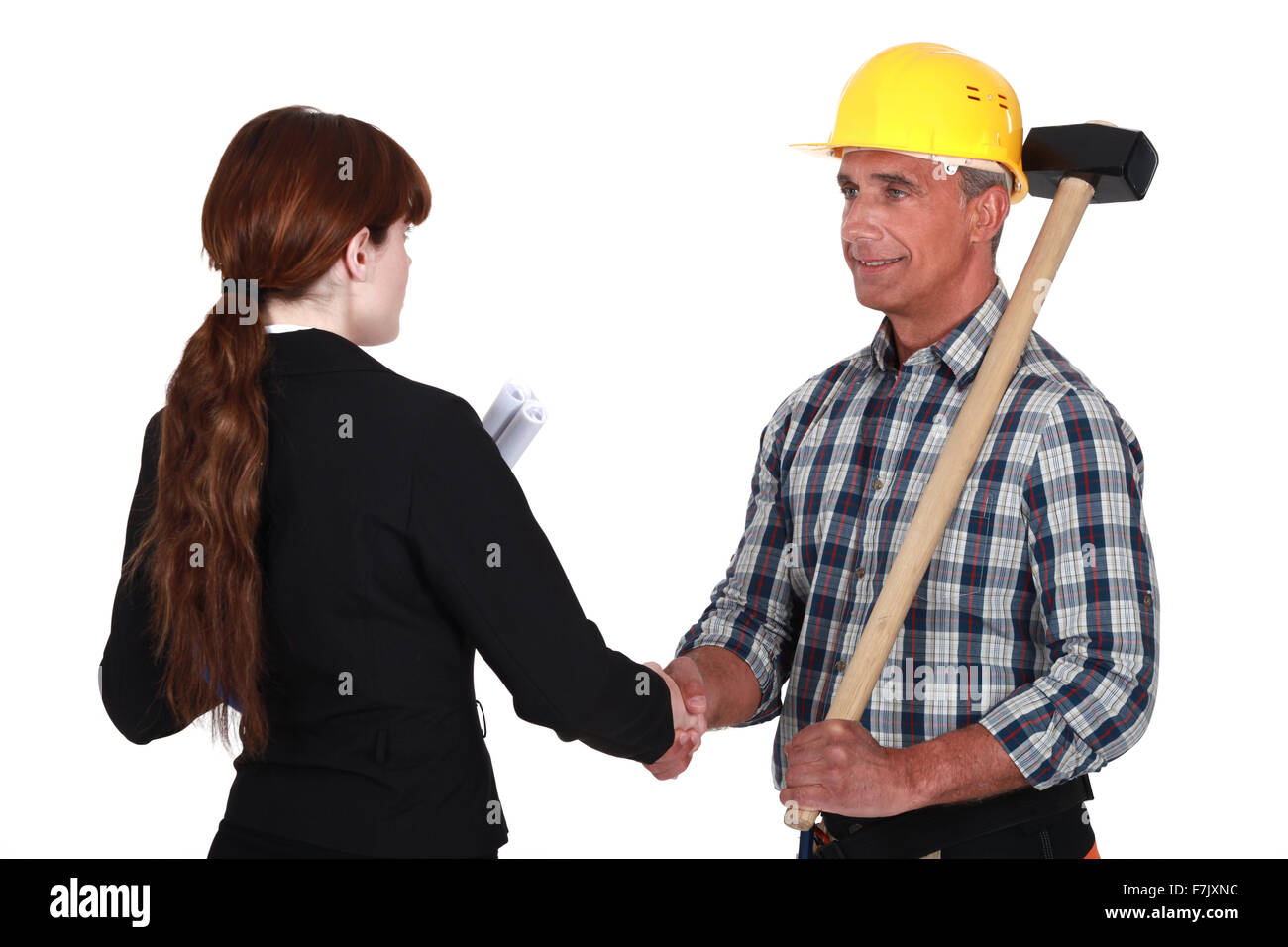 Female architect greeting builder Stock Photo - Alamy