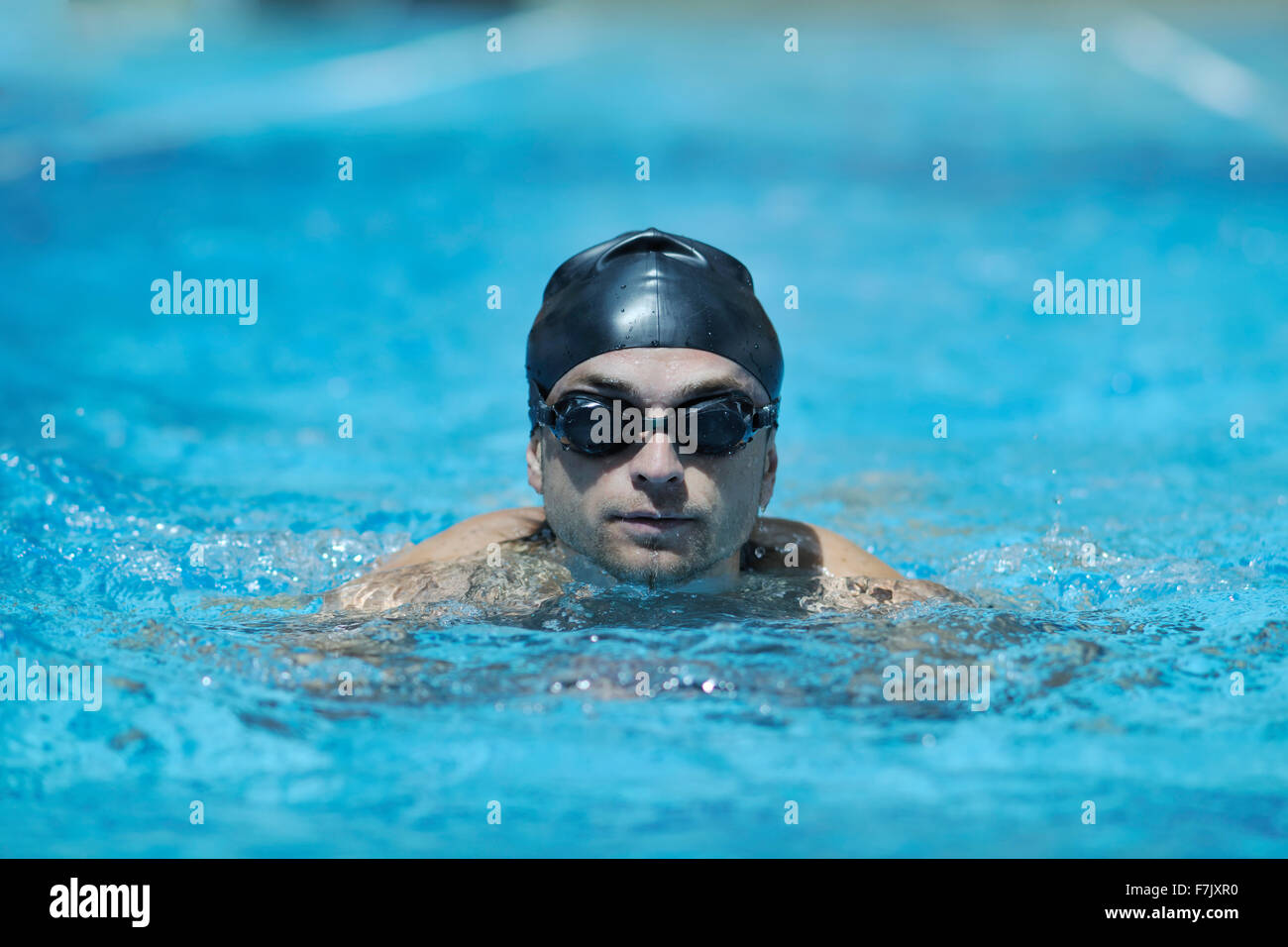 young healthy with muscular body man swim on swimming pool and ...
