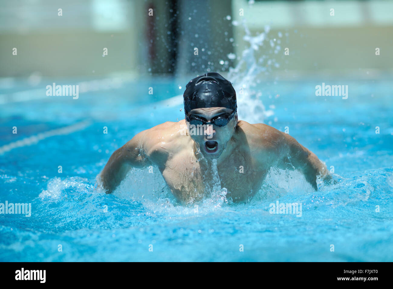 young healthy with muscular body man swim on swimming pool and ...