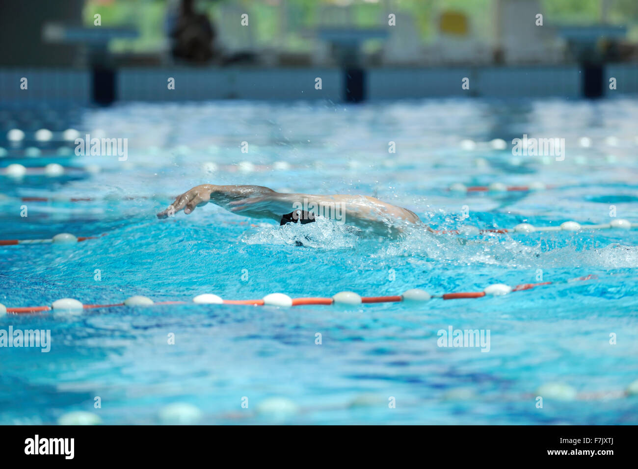 young healthy with muscular body man swim on swimming pool and ...