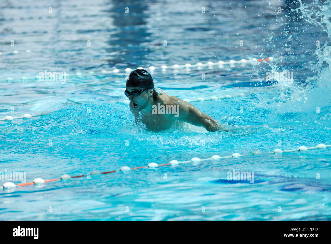 young healthy with muscular body man swim on swimming pool and ...