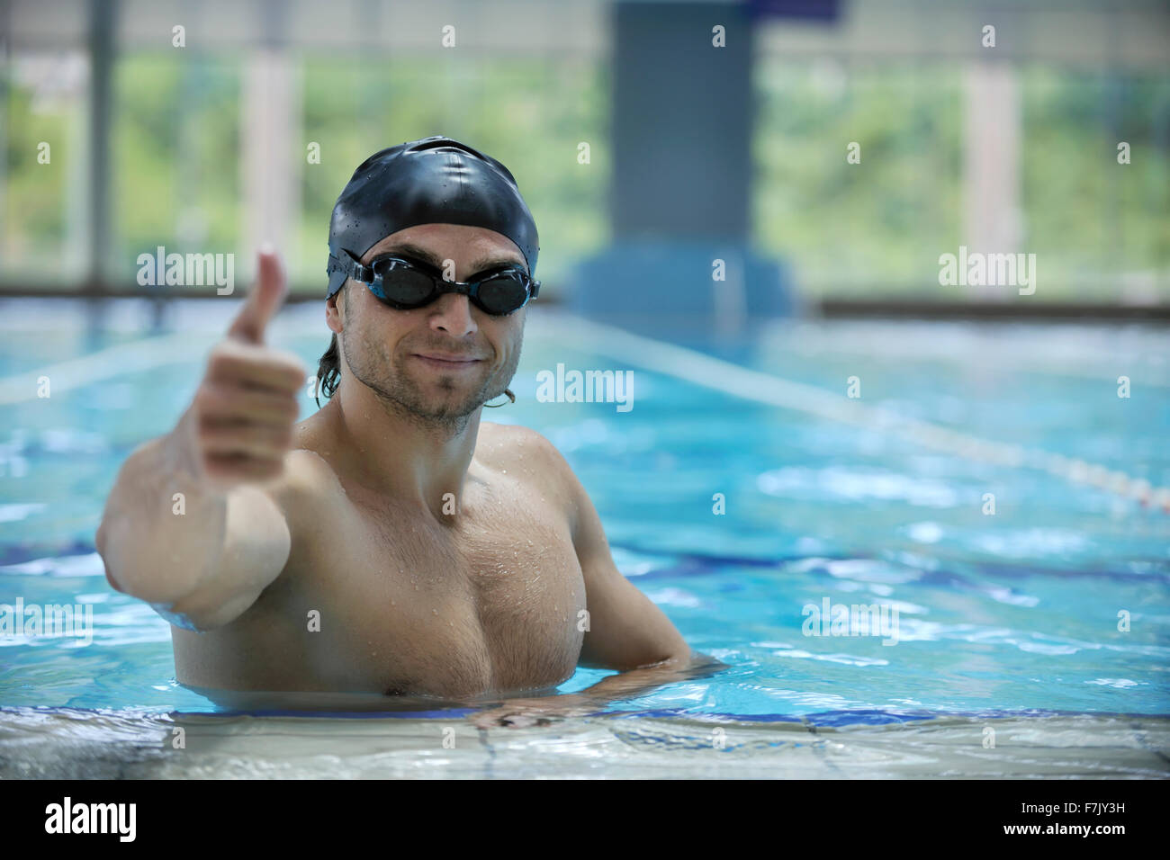 young healthy with muscular body man swim on swimming pool and ...