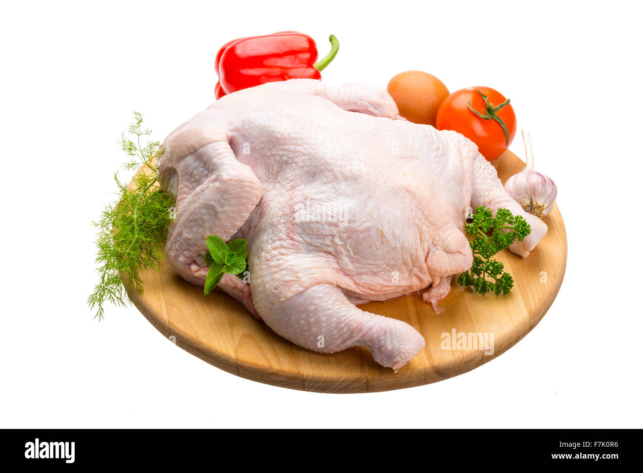 Uncoocked chicken with herbs Stock Photo - Alamy
