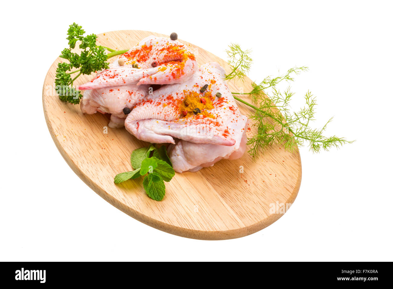 Uncoocked chicken with herbs Stock Photo - Alamy
