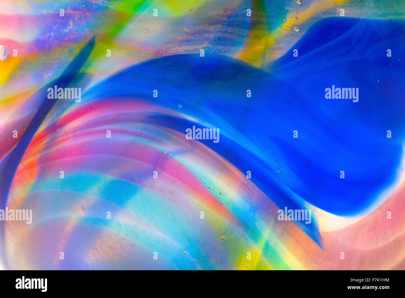 Light through coloured glass, showing an array of many bright colours ...