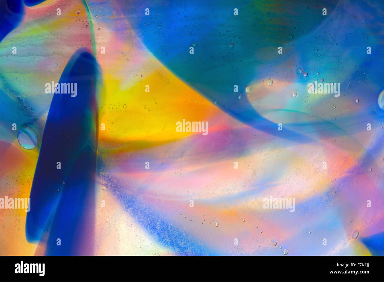 Light through coloured glass, showing an array of many bright colours ...