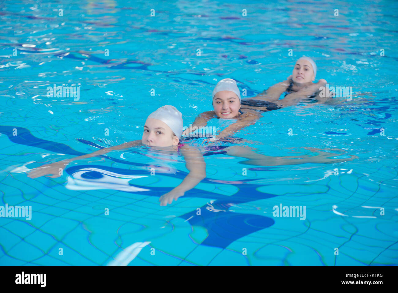 help and rescue action in swimming school at pool Stock Photo - Alamy