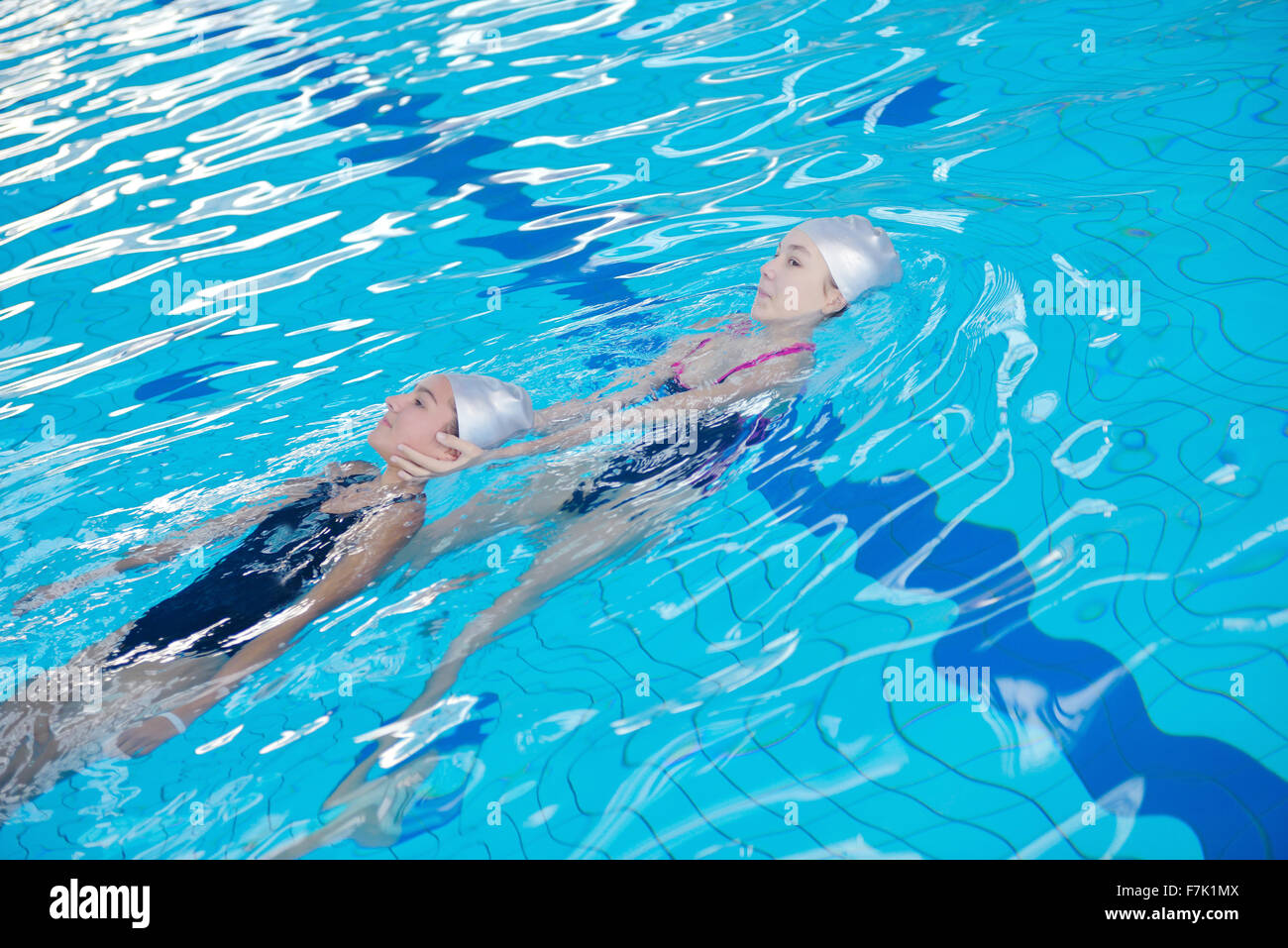 help and rescue action in swimming school at pool Stock Photo - Alamy