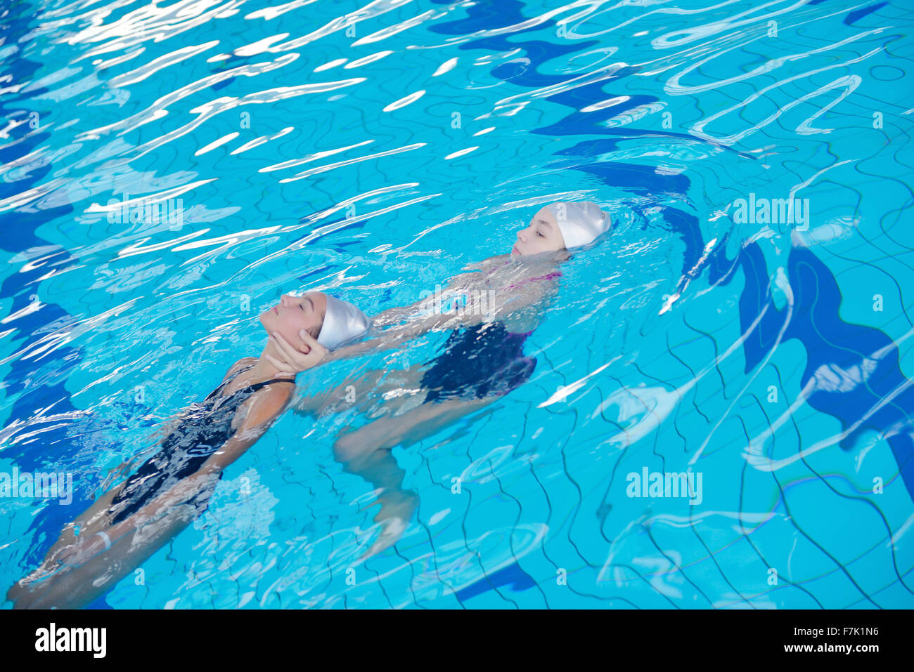 help and rescue action in swimming school at pool Stock Photo - Alamy