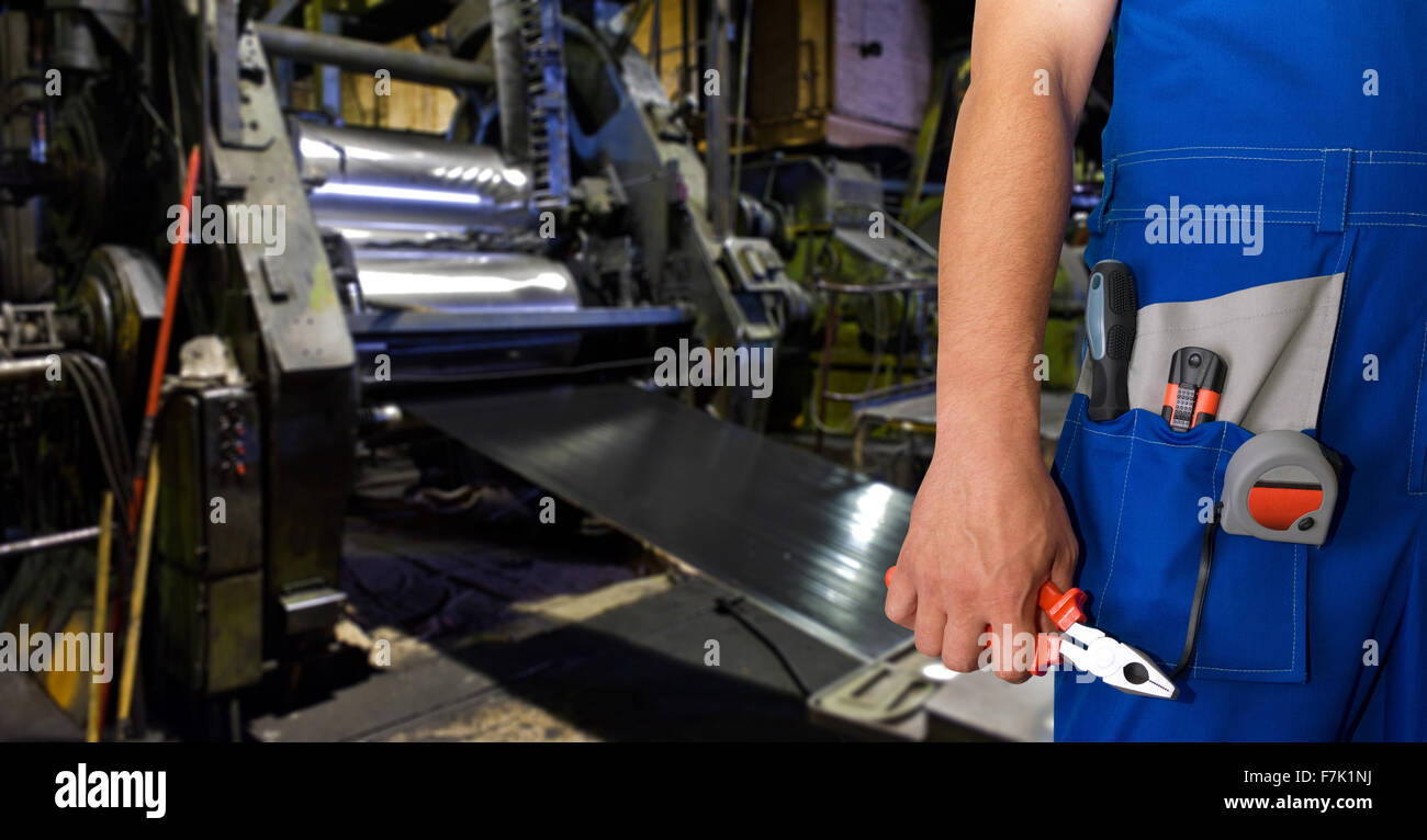 Worker with instruments Stock Photo - Alamy
