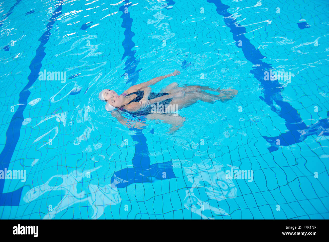 help and rescue action in swimming school at pool Stock Photo - Alamy