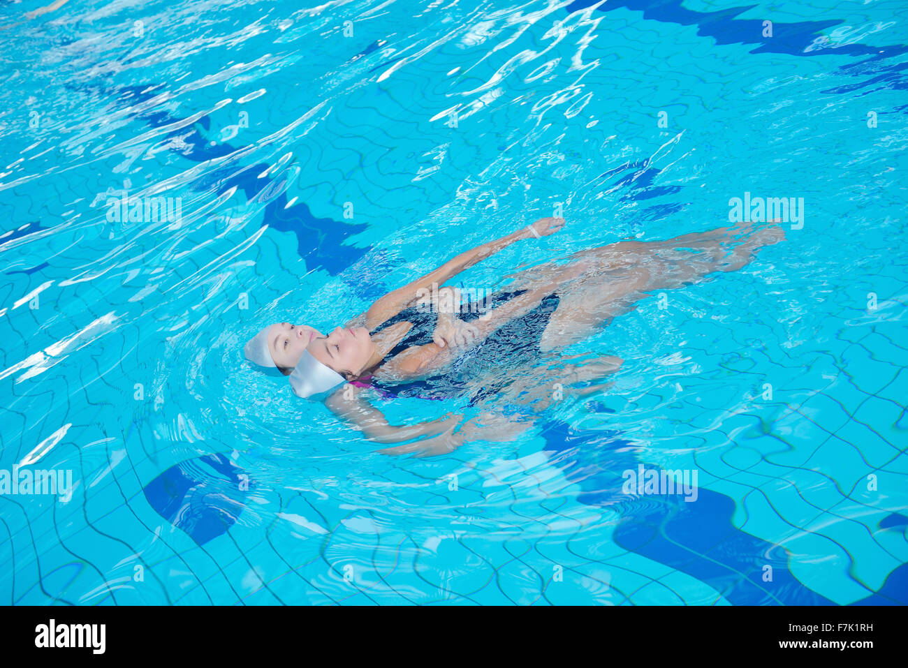 help and rescue action in swimming school at pool Stock Photo - Alamy