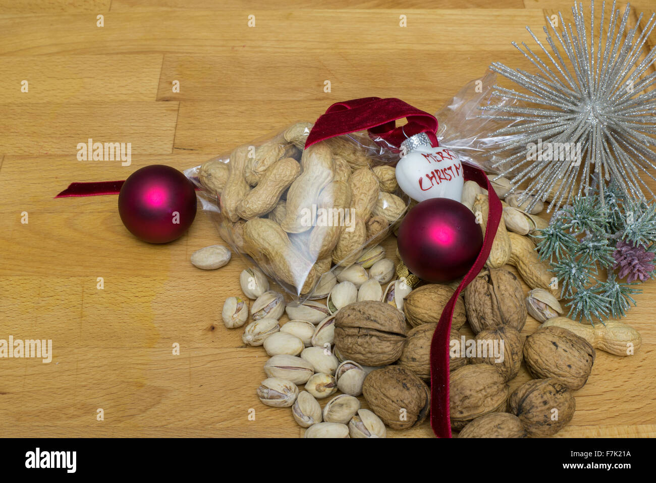 peanuts packed as a present together with other nuts Stock Photo - Alamy