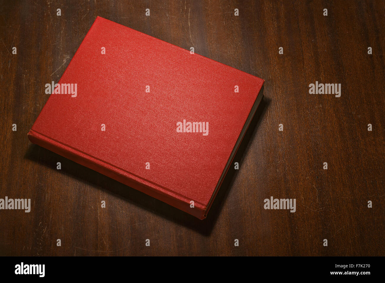 Red book on the table Stock Photo - Alamy