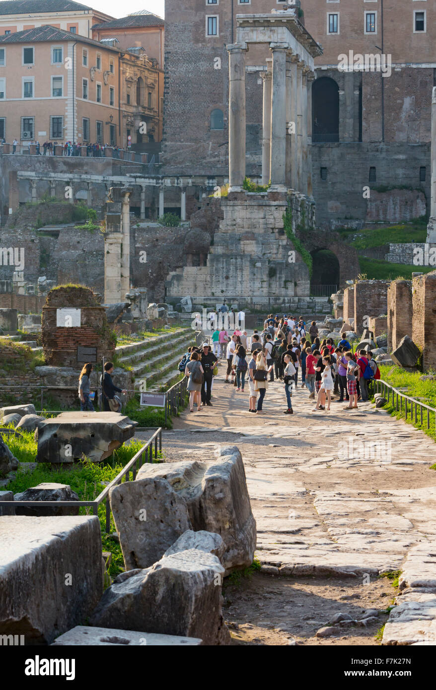 Rome, Italy. Visitors in the Roman Forum walking towards the ruins of ...