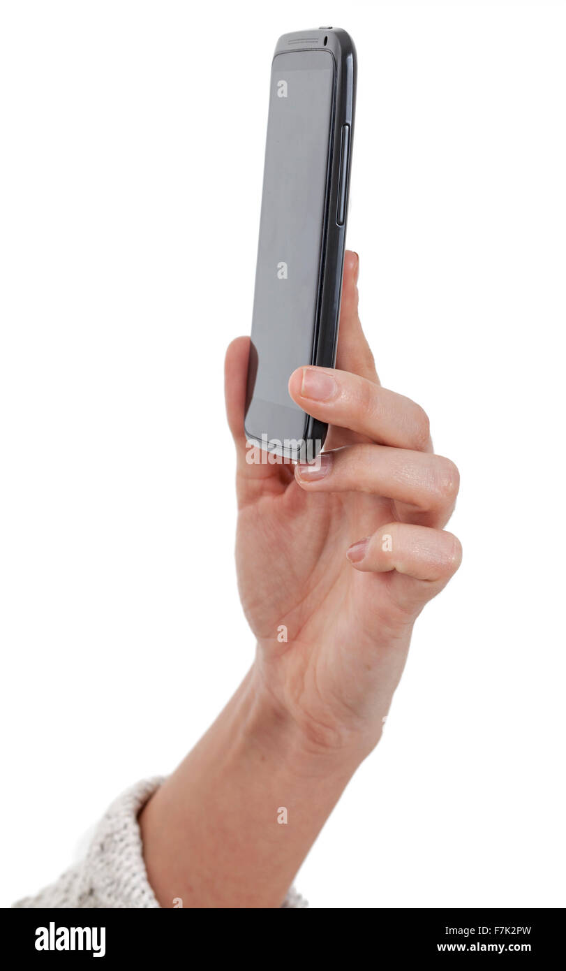 Left hand holding a smartphone isolated against a white background ...