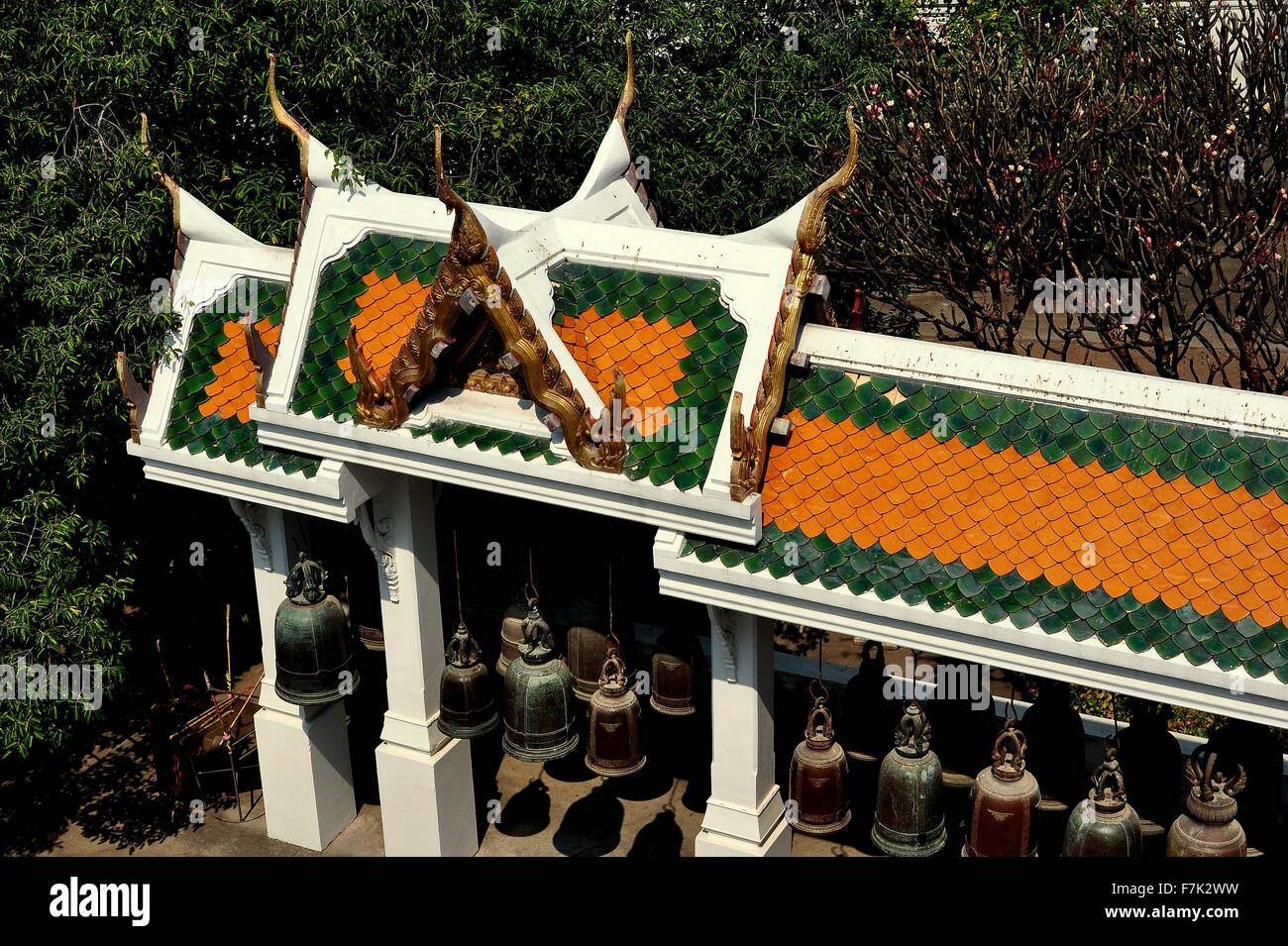 Saraburi, Thailand: Rows of bronze bells hang from a small pavilion ...