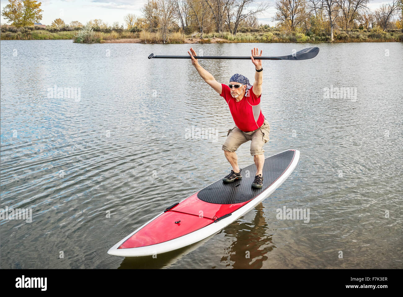 Stand up paddling yoga hi-res stock photography and images - Alamy