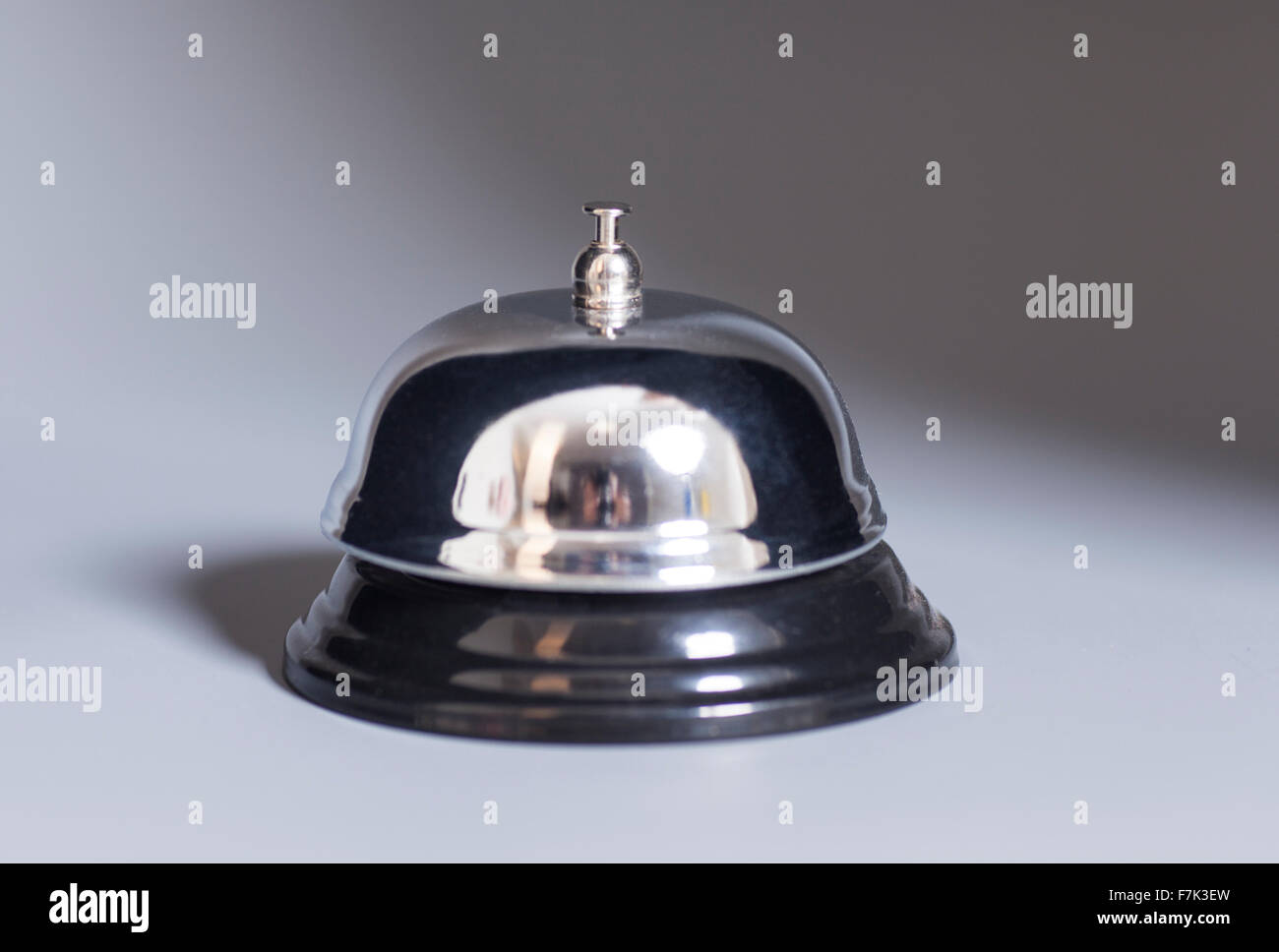 Service bell on gray background Stock Photo - Alamy