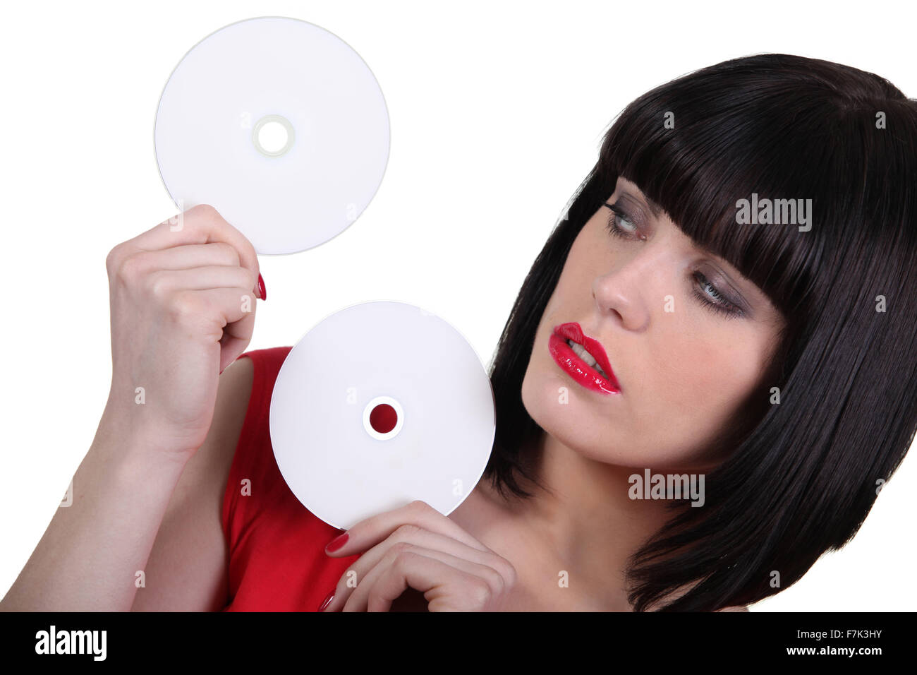 Brunette woman looking cds Stock Photo - Alamy