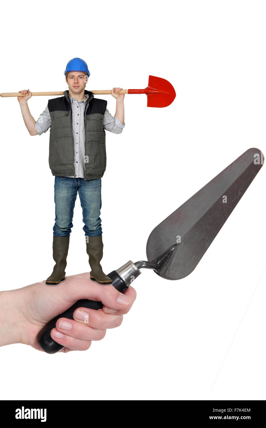 Manual worker with shovel Stock Photo - Alamy