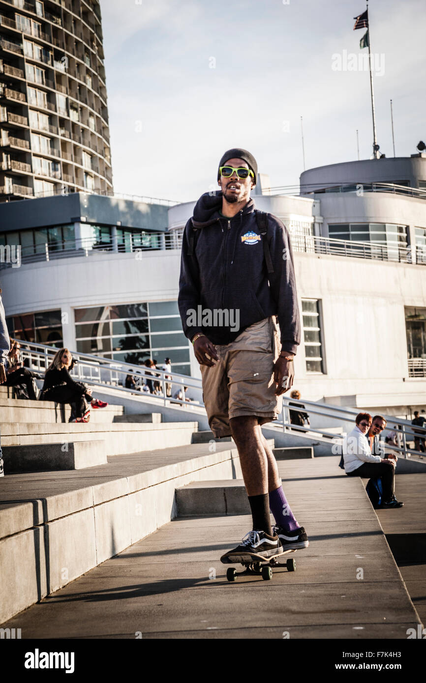 Guy Skating and People watching the sunset in San Francisco Maritime ...