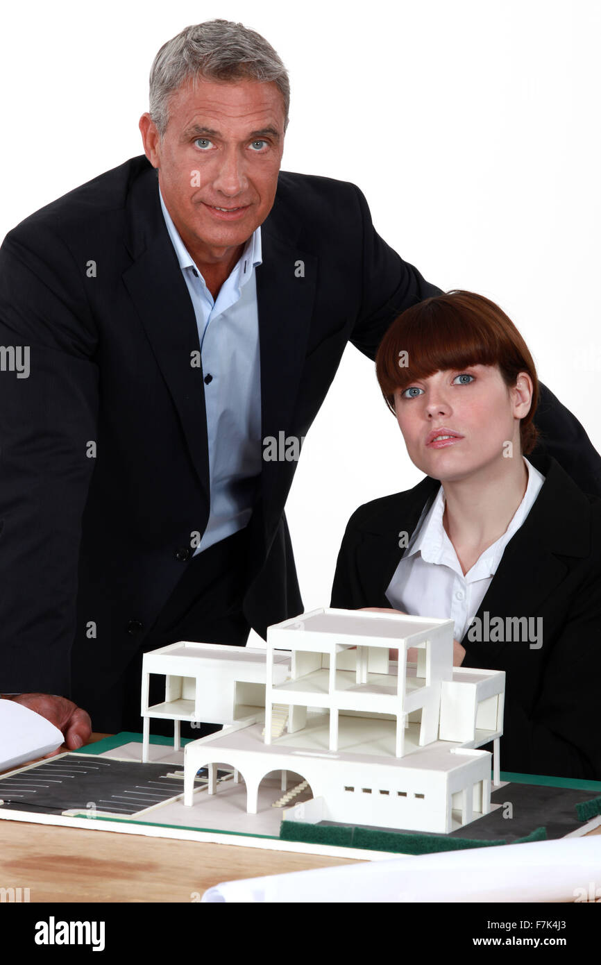 Architects posing building model hi-res stock photography and images ...