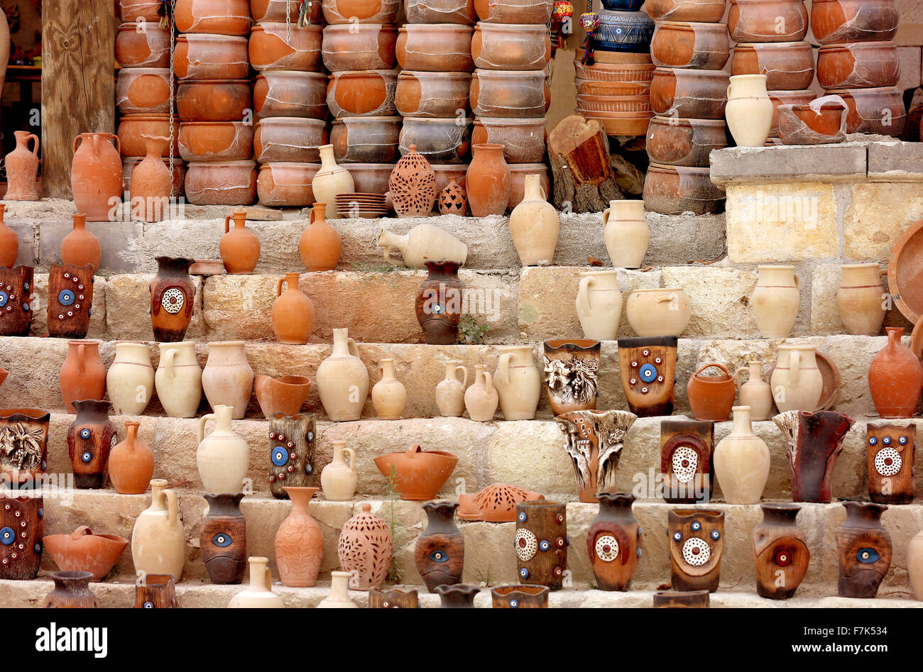 Beautiful clay pots on the shelf photographed close up Stock Photo - Alamy