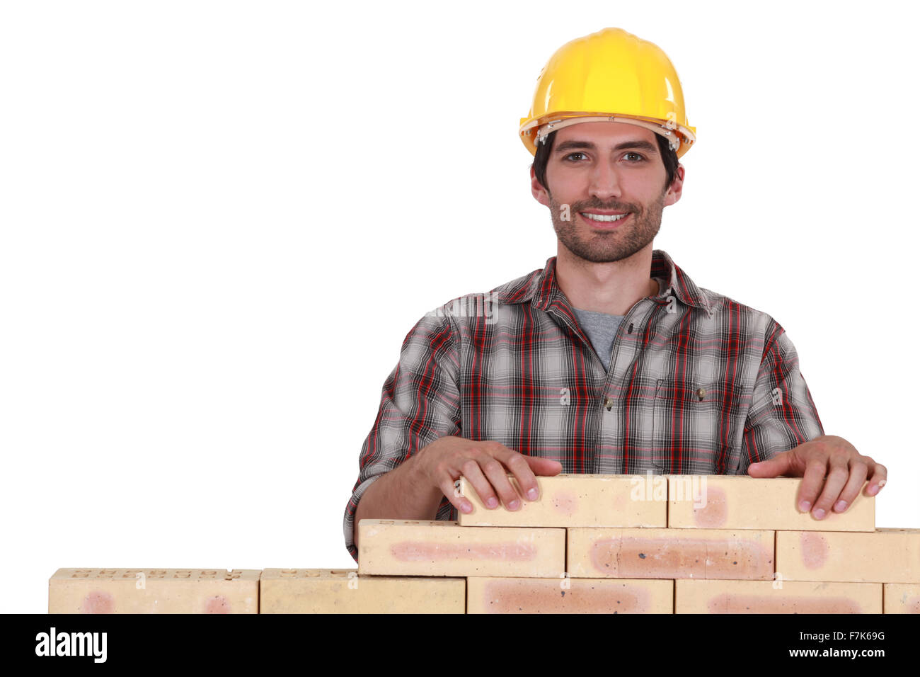 Man building brick wall Stock Photo - Alamy