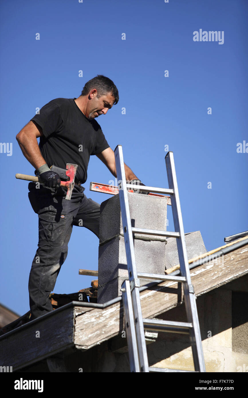 Man building chimney Stock Photo - Alamy